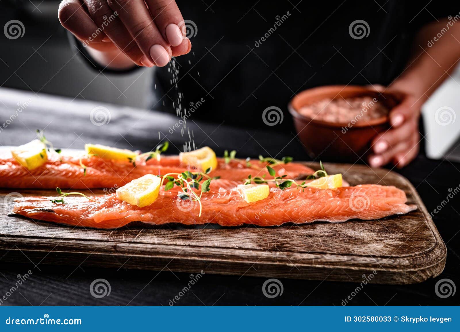 Chief Salting Raw Red Trout Fish for Cooking with Lemon Stock Image ...