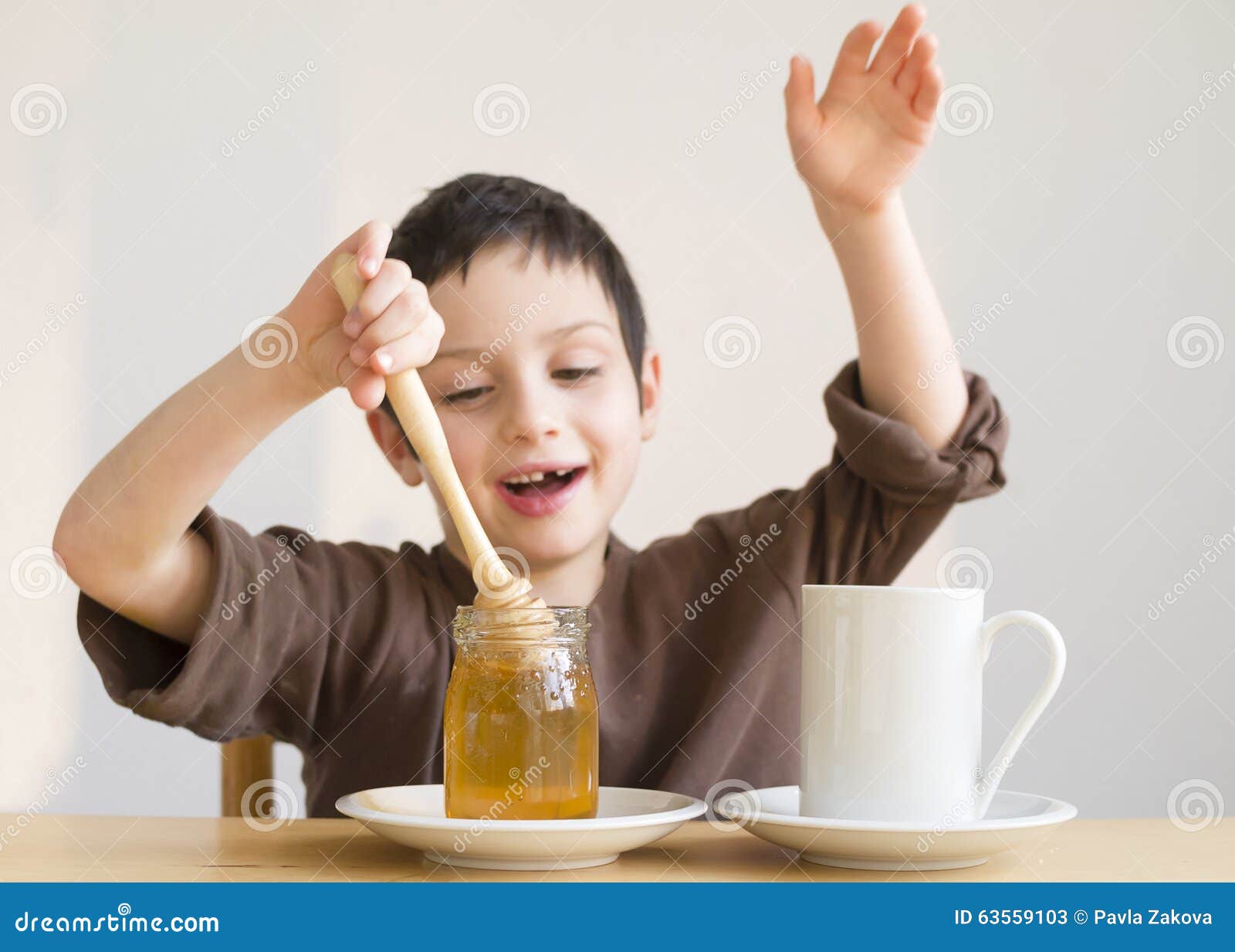 Child Adding Honey in Cup of Tea Stock Image - Image of diet, laughing ...