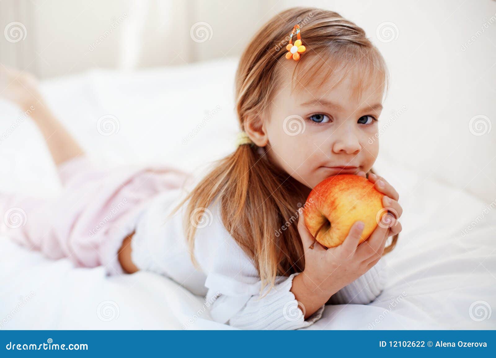 Child with apple stock photo. Image of bedroom, adorable - 12102622