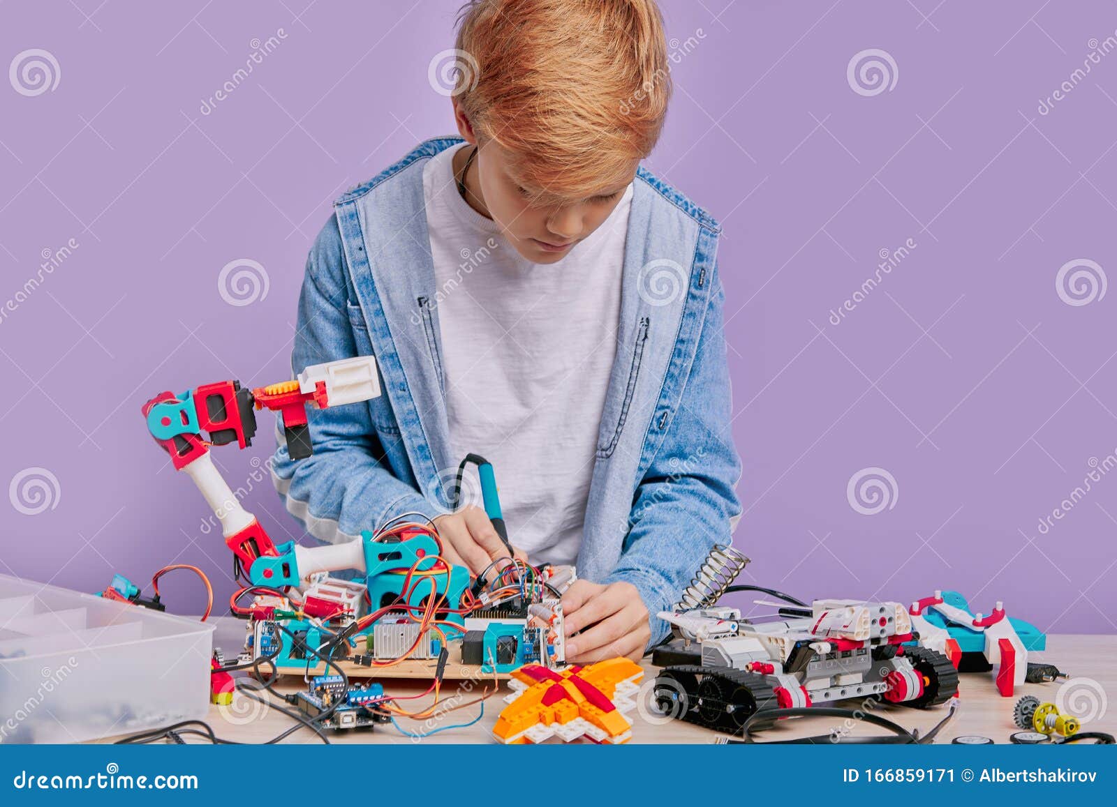 Child Assembling Robots on Table Stock Image - Image of child, creating ...