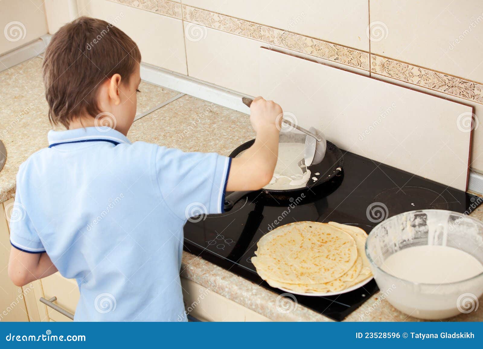 Child bakes pancakes stock photo. Image of breakfast - 23528596