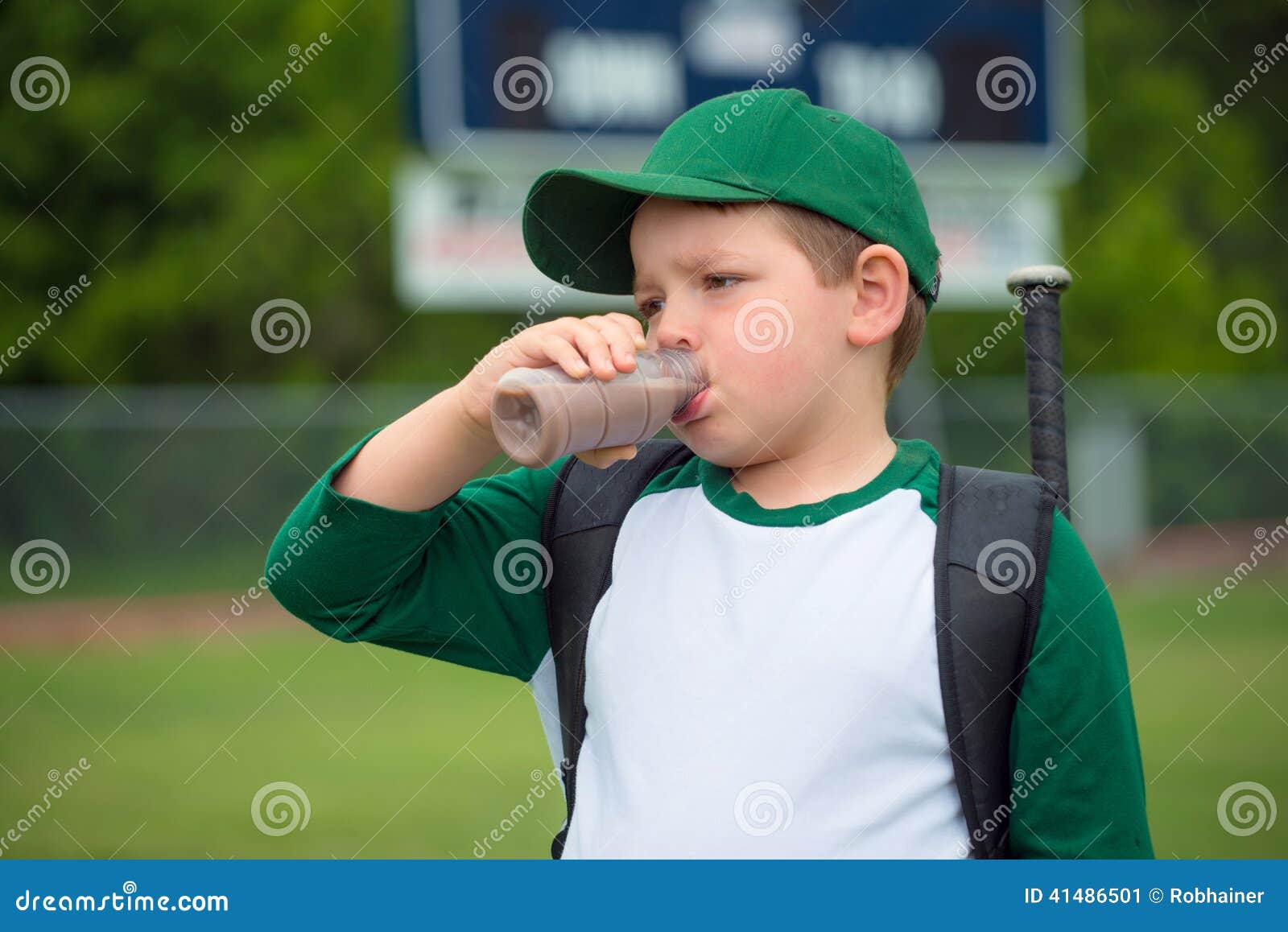 Child Baseball Player Drinking Chocolate Milk Stock Image - Image of ...