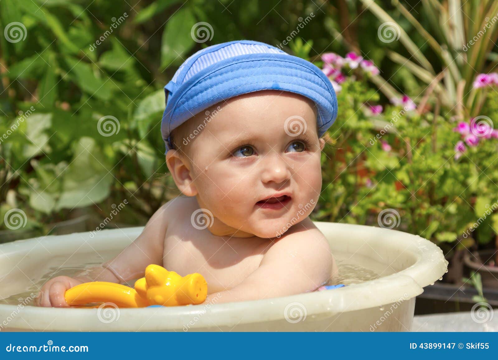 Child is bathed in a basin stock image. Image of face - 43899147