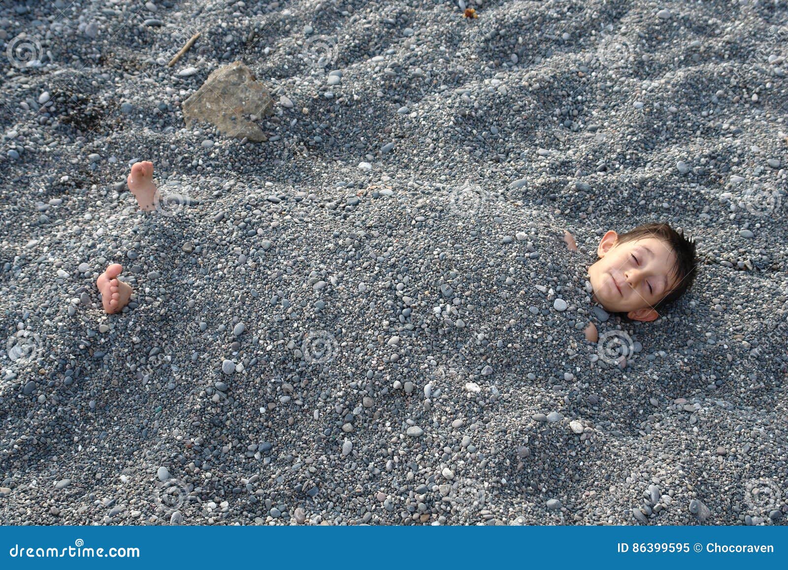 Child on the Beach Covered with Pebbles Stock Image - Image of ...