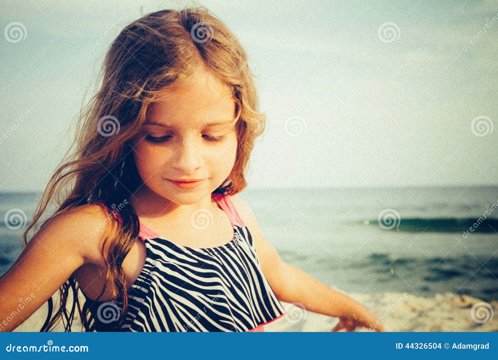 Child playing on the beach stock photo. Image of casual - 44326504