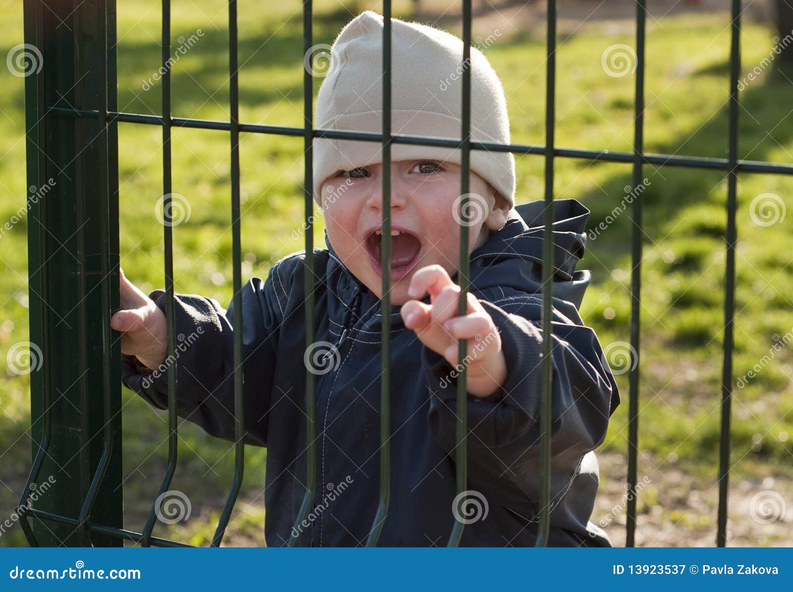 Child behind a gate stock image. Image of outdoors, grass - 13923537
