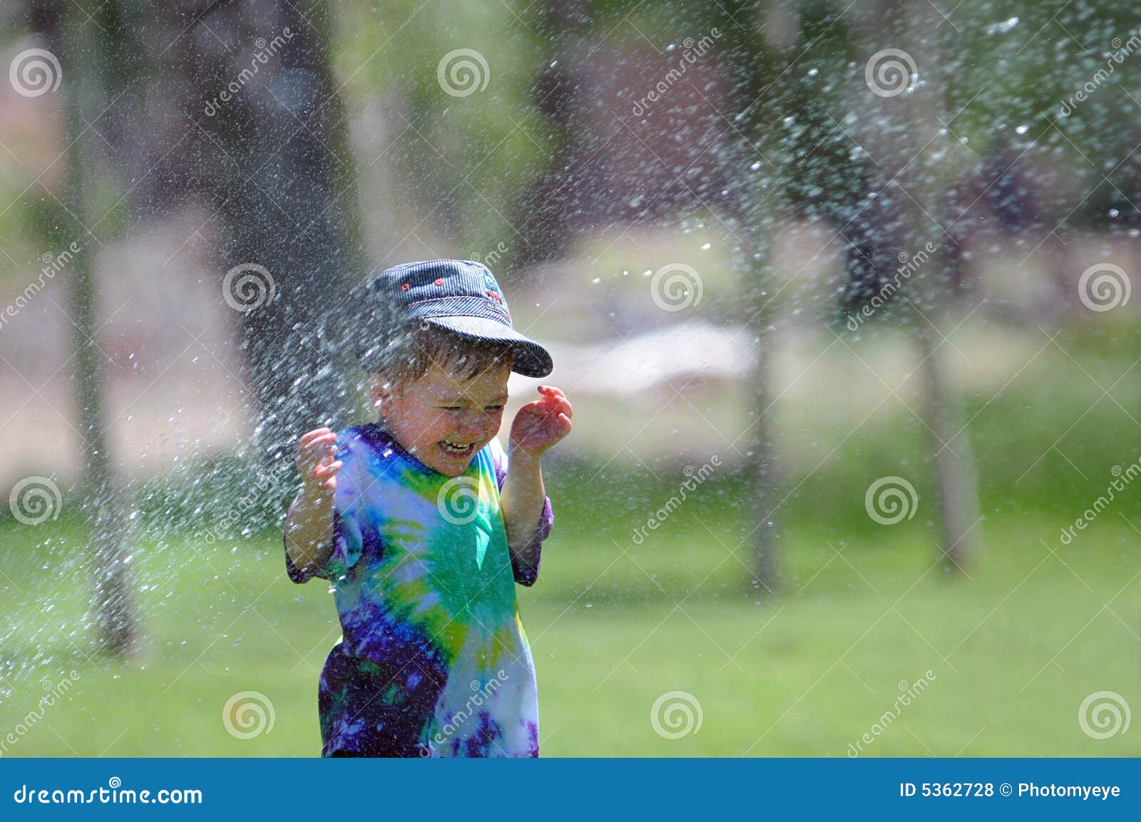 Child Being Sprayed by Water Stock Photo - Image of excited, enjoys ...