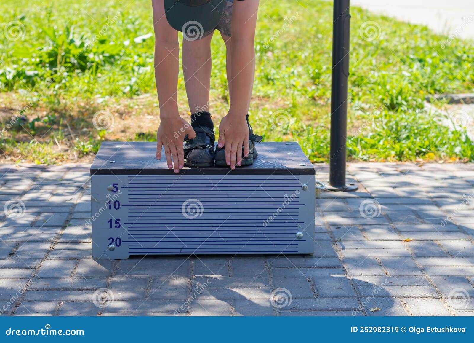 The Child Bends Forward To the Measuring Scale To Check the Flexibility ...