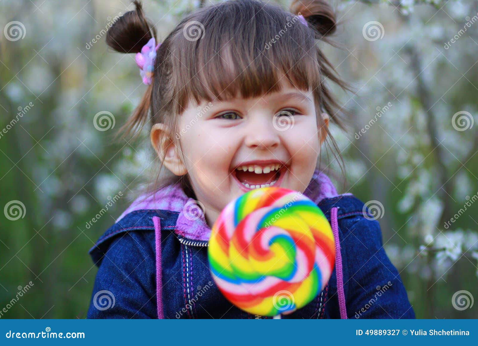 The Child with the Big Sweet Stock Image - Image of laughing, grass ...