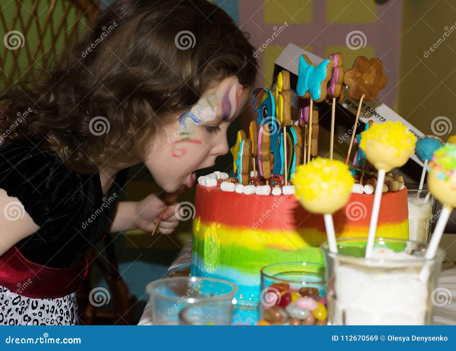 Child bite a rainbow cake stock image. Image of cute - 112670569