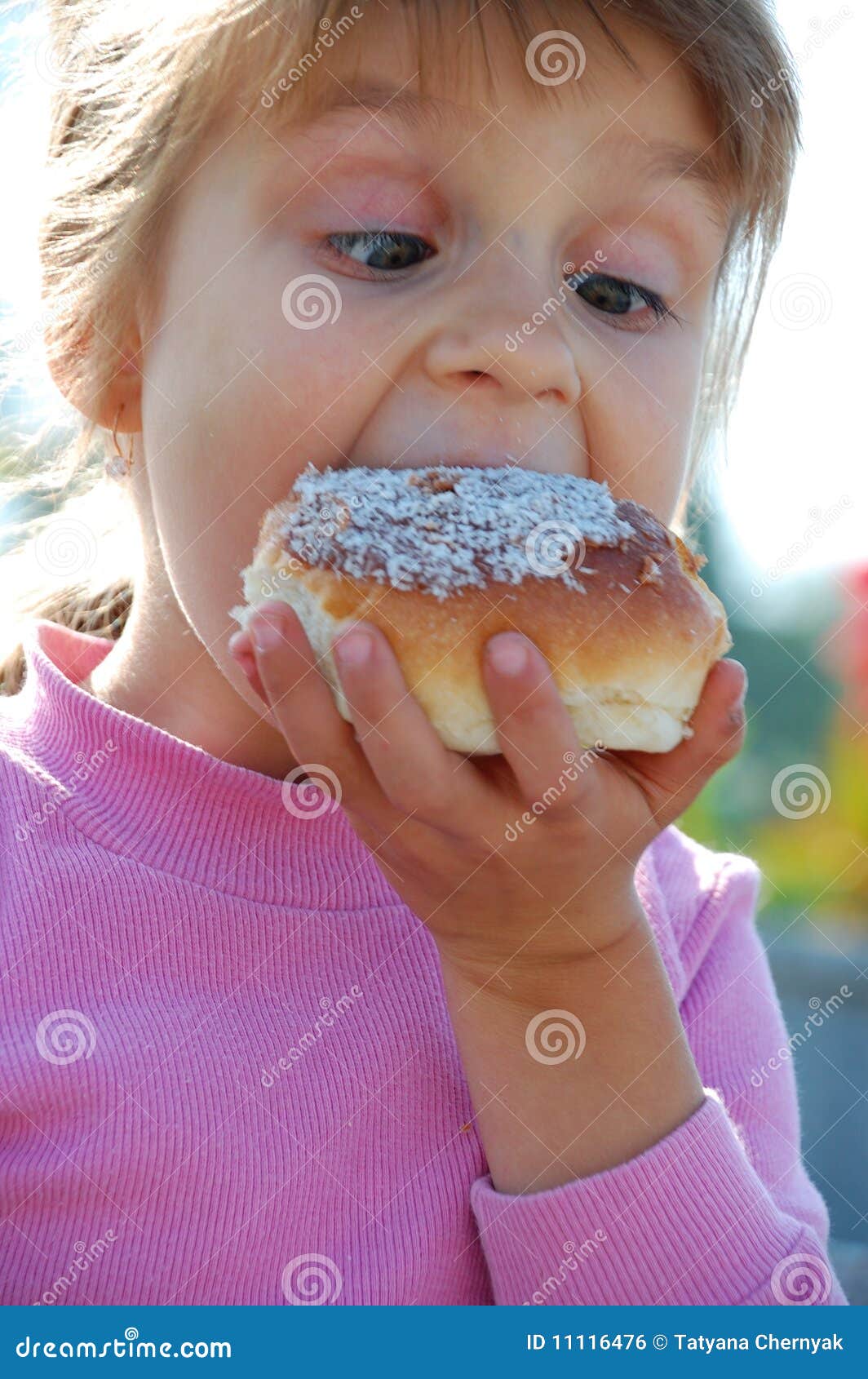 Child biting a doughnut stock photo. Image of biting - 11116476