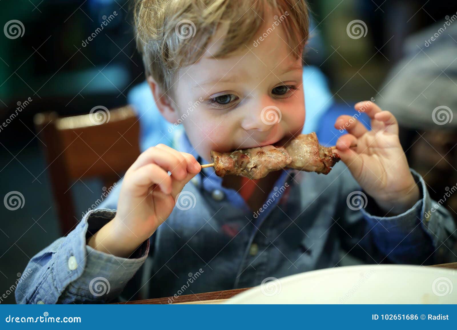 Child biting kebab stock photo. Image of childhood, looking - 102651686