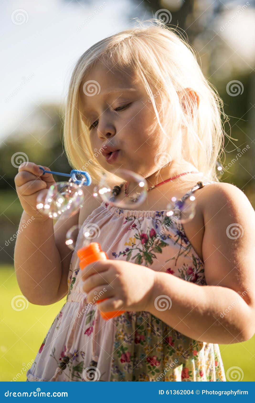 Child blowing bubbles stock photo. Image of summer, girl - 61362004