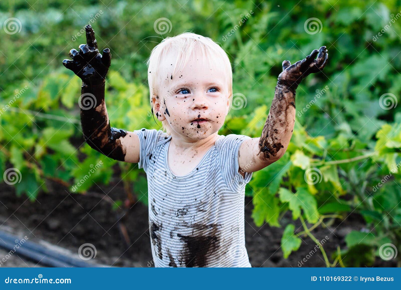 Child Playing in the Mud on the Street Stock Photo - Image of dirty ...