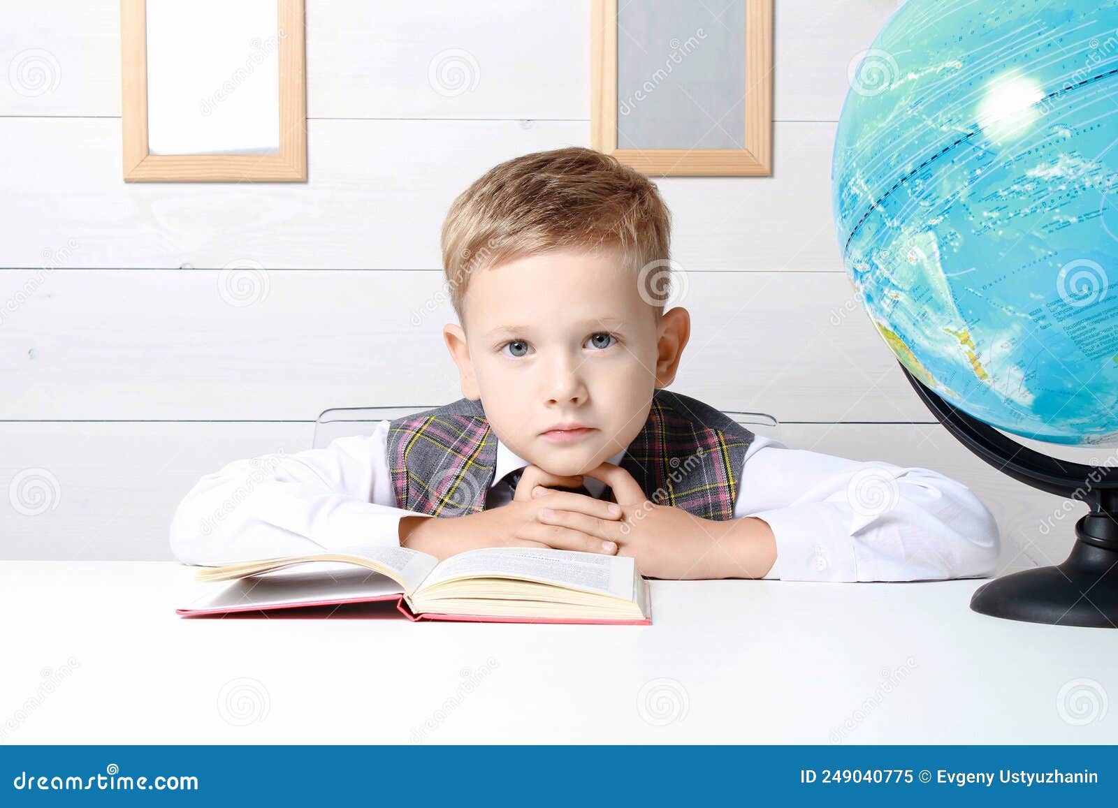 Child with Book. Handsome Little Boy in a School Uniform Teaches ...