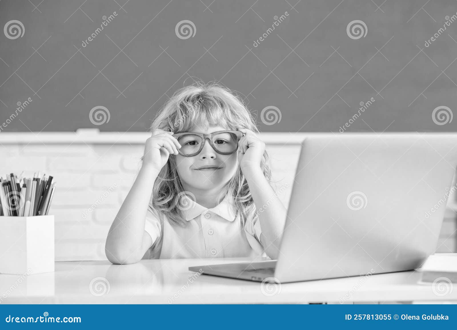 Child Boy in Glasses Study Online in School Classrrom with Laptop ...