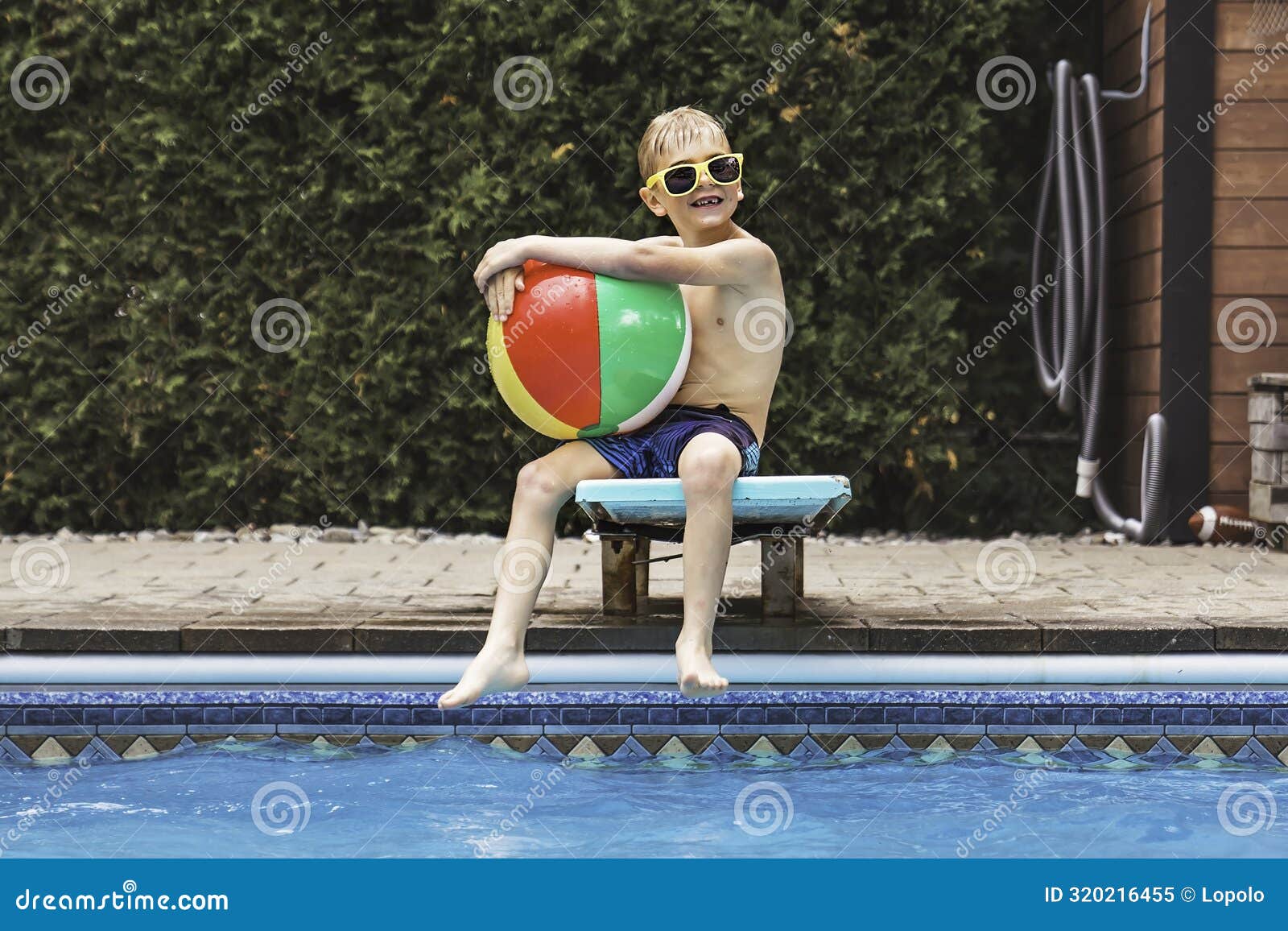 Child Boy Having Fun in Pool on the Summer Time Sit on Springboard ...