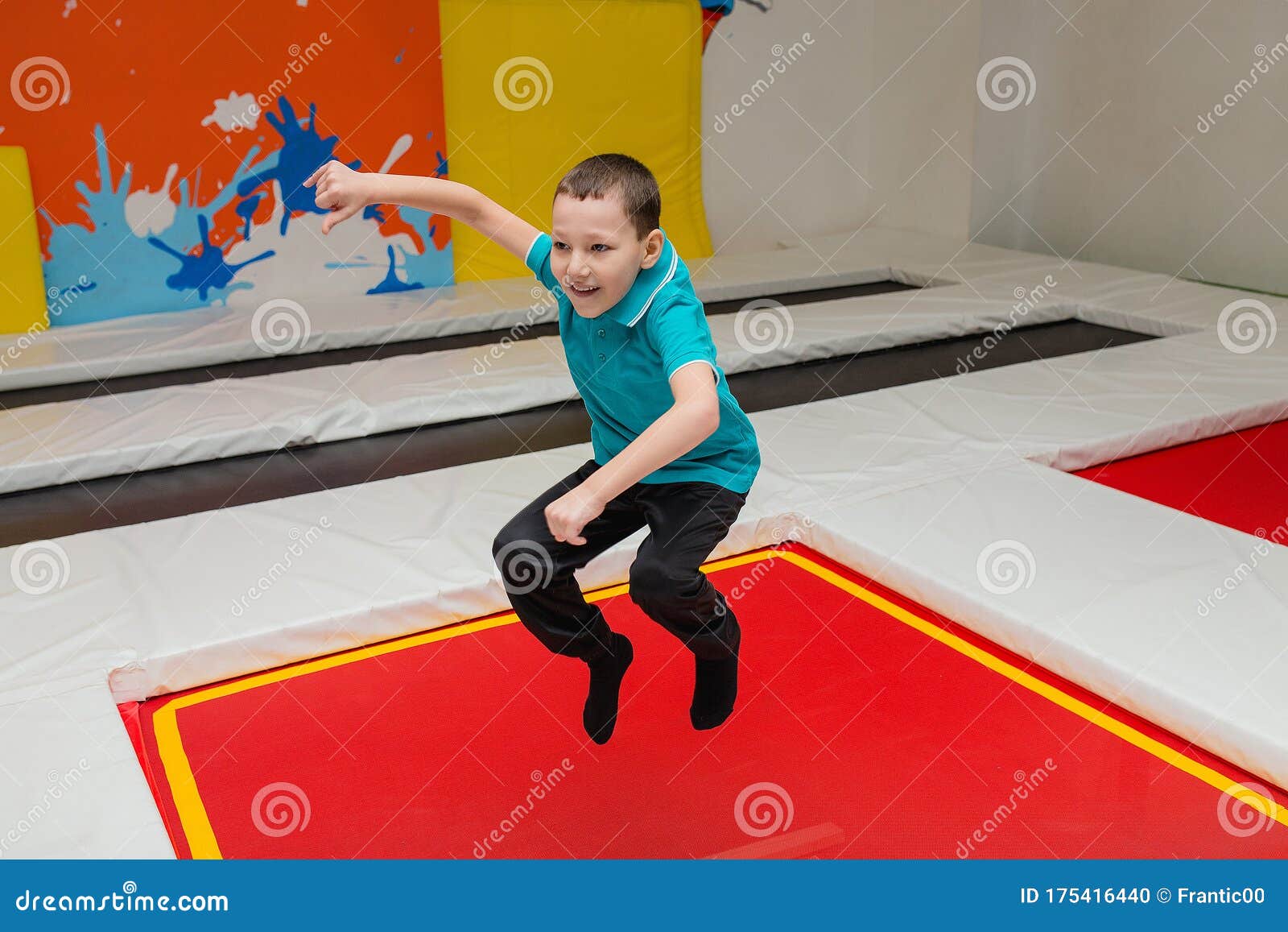 Boy Jumping on Trampoline in Fly Park Stock Photo - Image of indoors ...