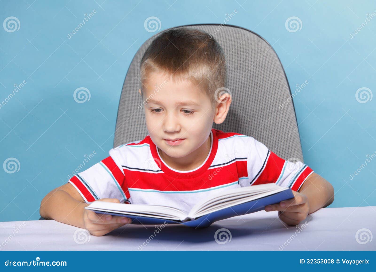 Child Boy Kid Reading a Book on Blue Stock Photo - Image of ...