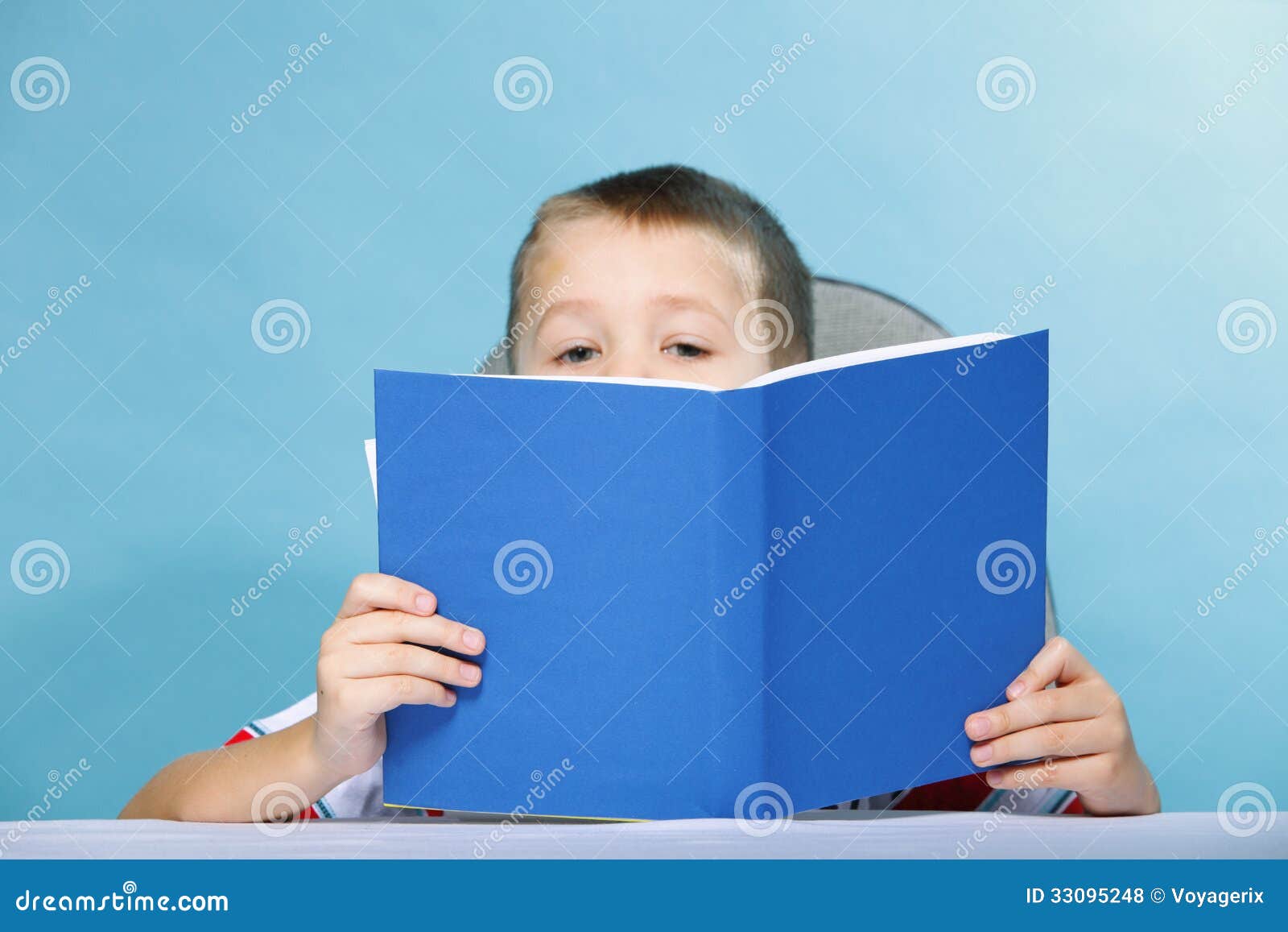 Child Boy Kid Reading a Book on Blue Stock Photo - Image of information ...