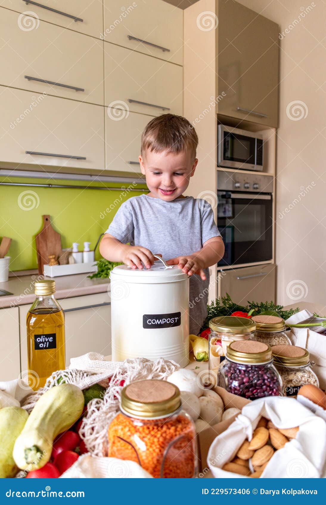 Child Boy Puts Food Waste in a Compost Bin. Waste Sorting Stock Photo ...