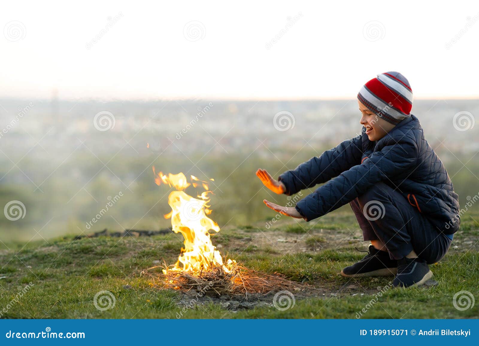 Child Boy Warming Near Bonfire Outdoors in Cold Weather Stock Image ...
