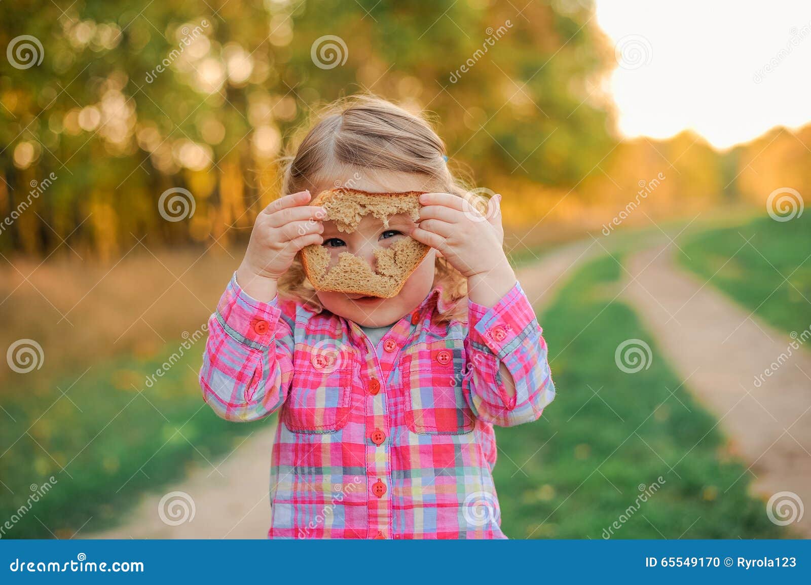 Child with bread stock photo. Image of lunch, picnic - 65549170