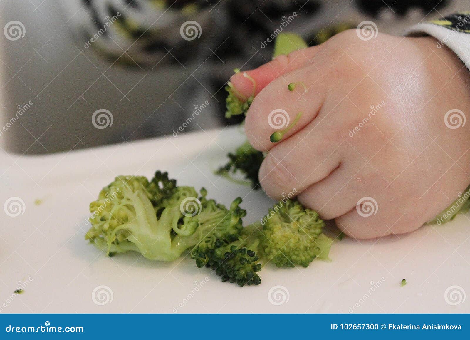 Child with broccoli stock photo. Image of dinner, children - 102657300