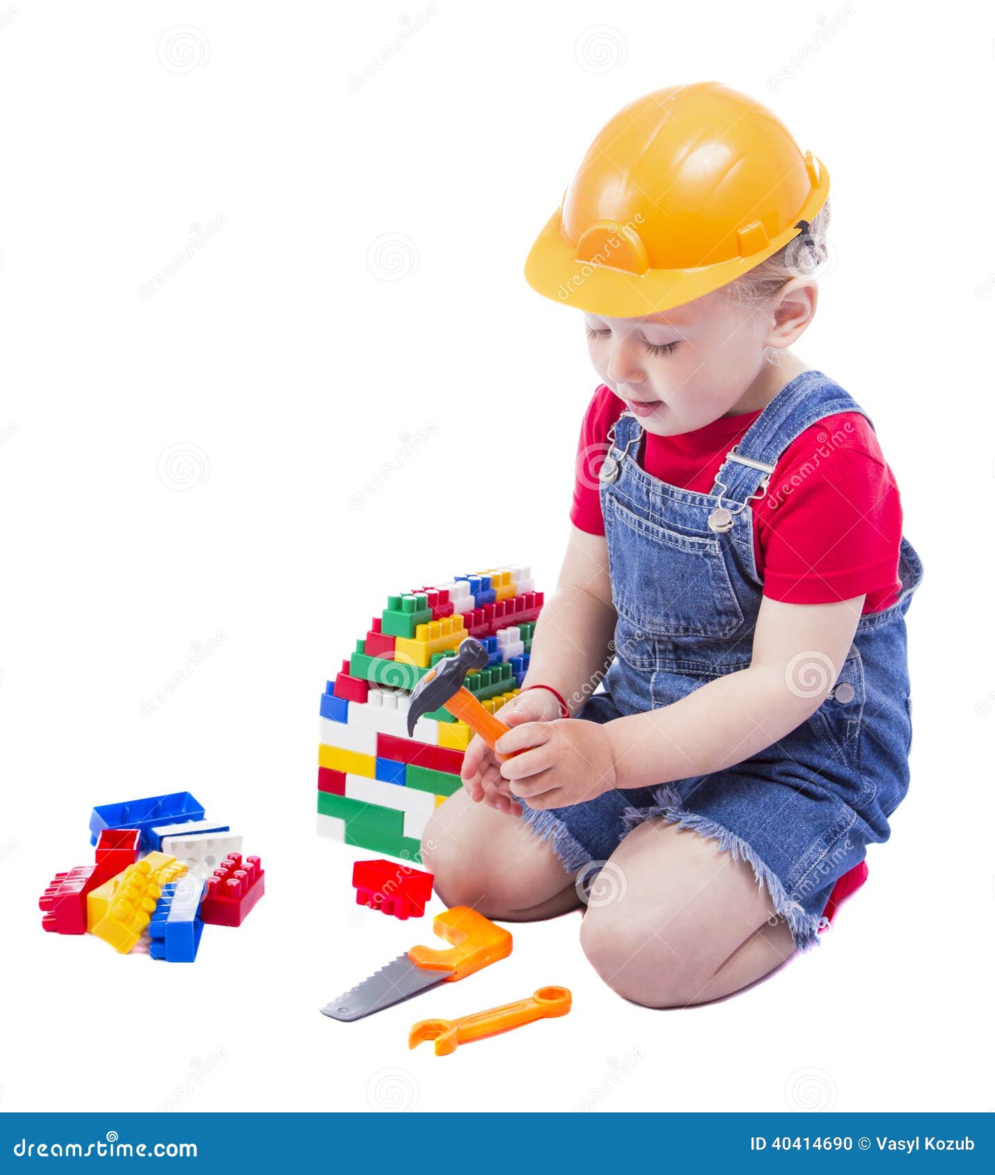 A Child Builder Holds A Construction Mixer Against The Background Of A ...