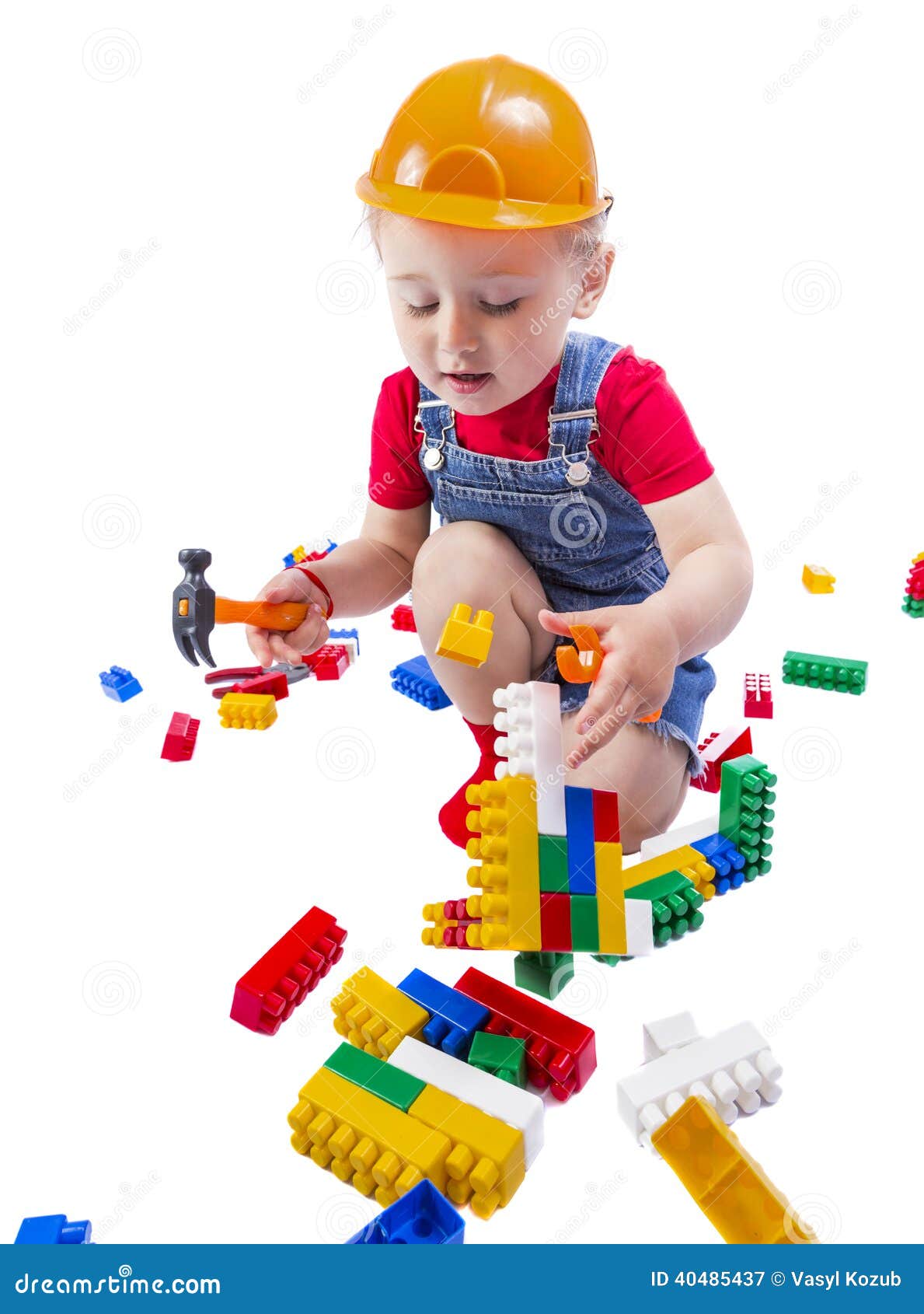 A Child Builder Holds A Construction Mixer Against The Background Of A ...