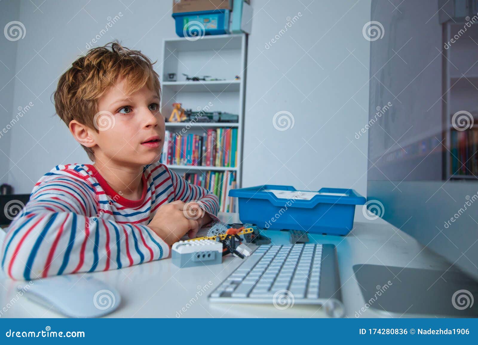 Child Building and Programming Robot on Computer Stock Photo - Image of ...
