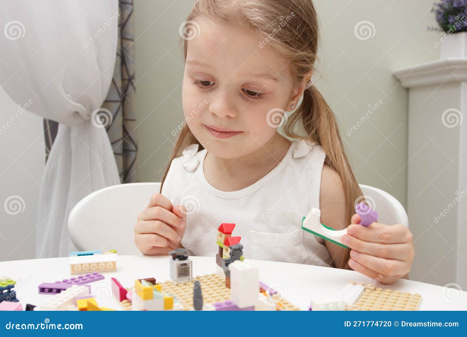 Child Builds with Constructor Bricks, Plays with Toys Stock Photo ...