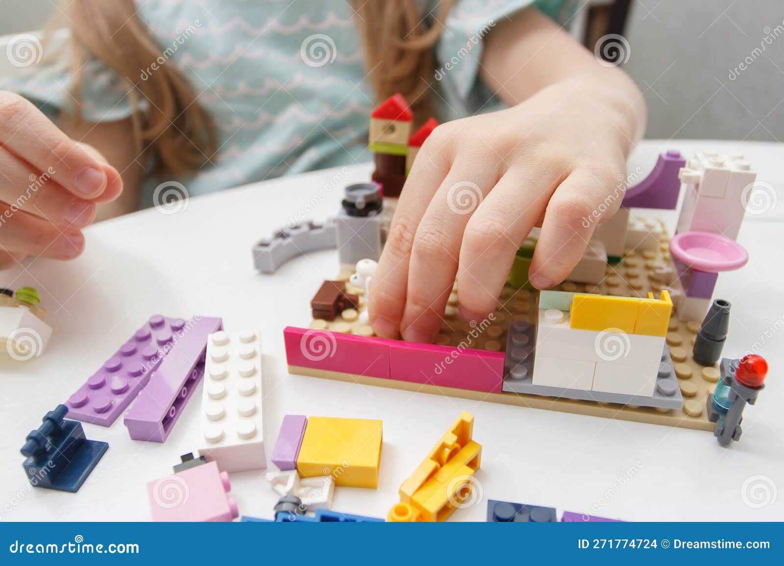 Child Builds with Constructor Bricks, Plays with Toys Stock Photo ...