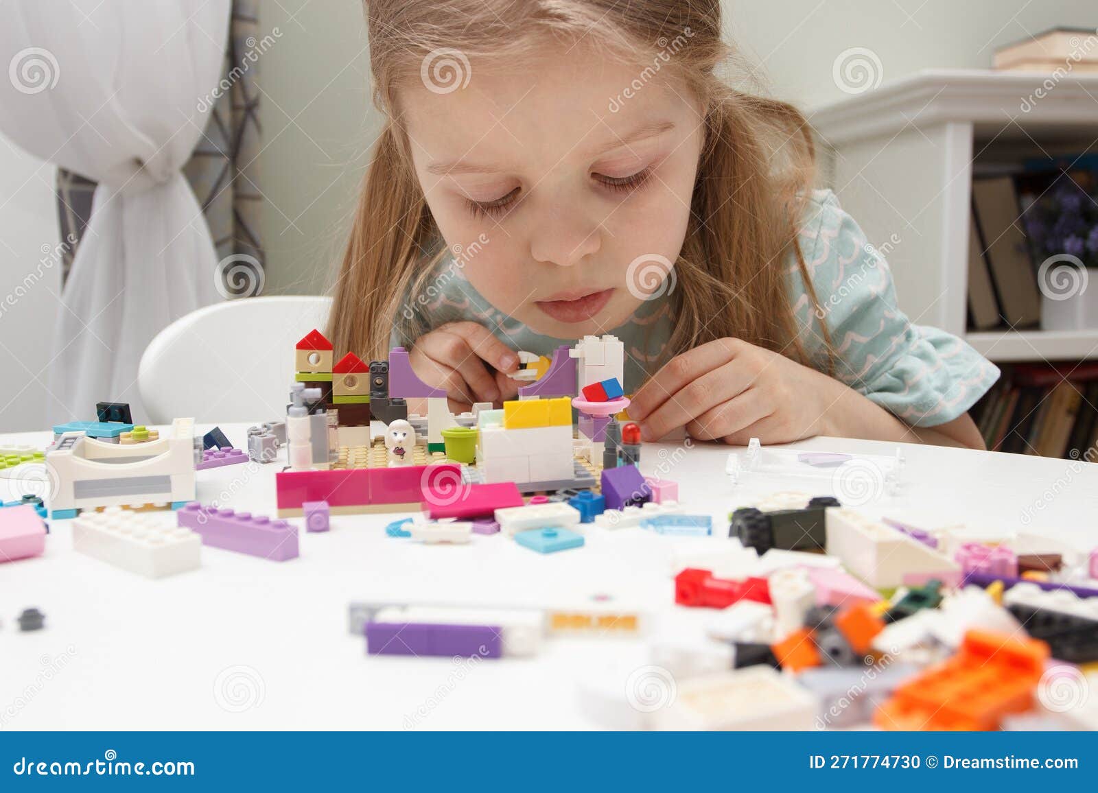 Child Builds with Constructor Bricks, Plays with Toys Stock Photo ...