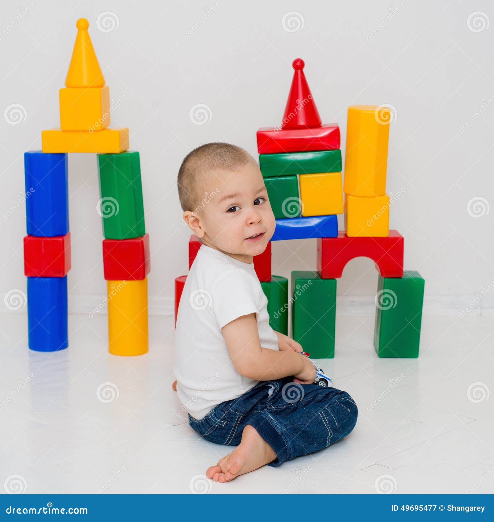 Child Builds a Tower of Cubes Stock Image - Image of activity, puzzle ...