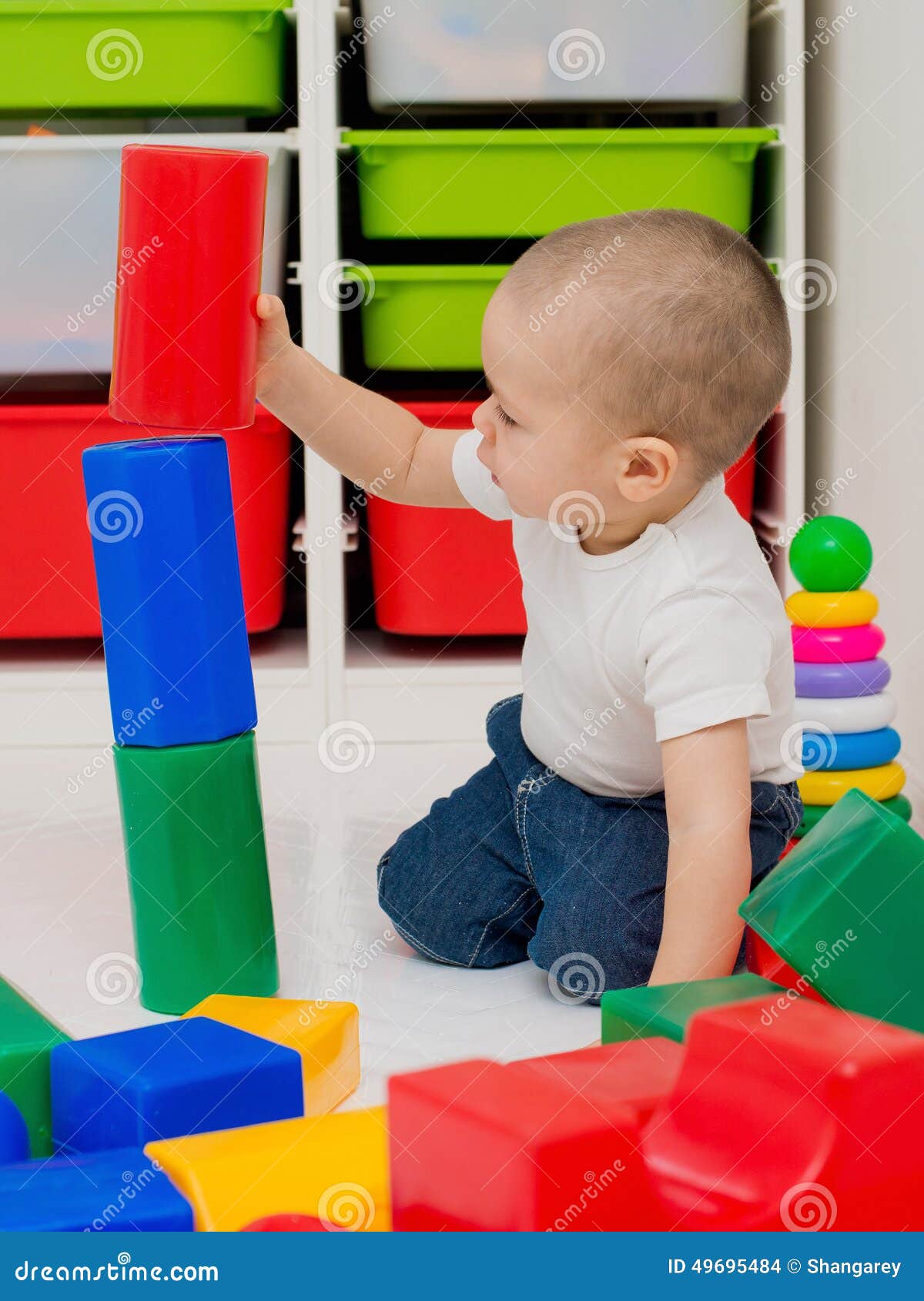 Child Builds a Tower of Cubes Stock Photo - Image of playing, playful ...