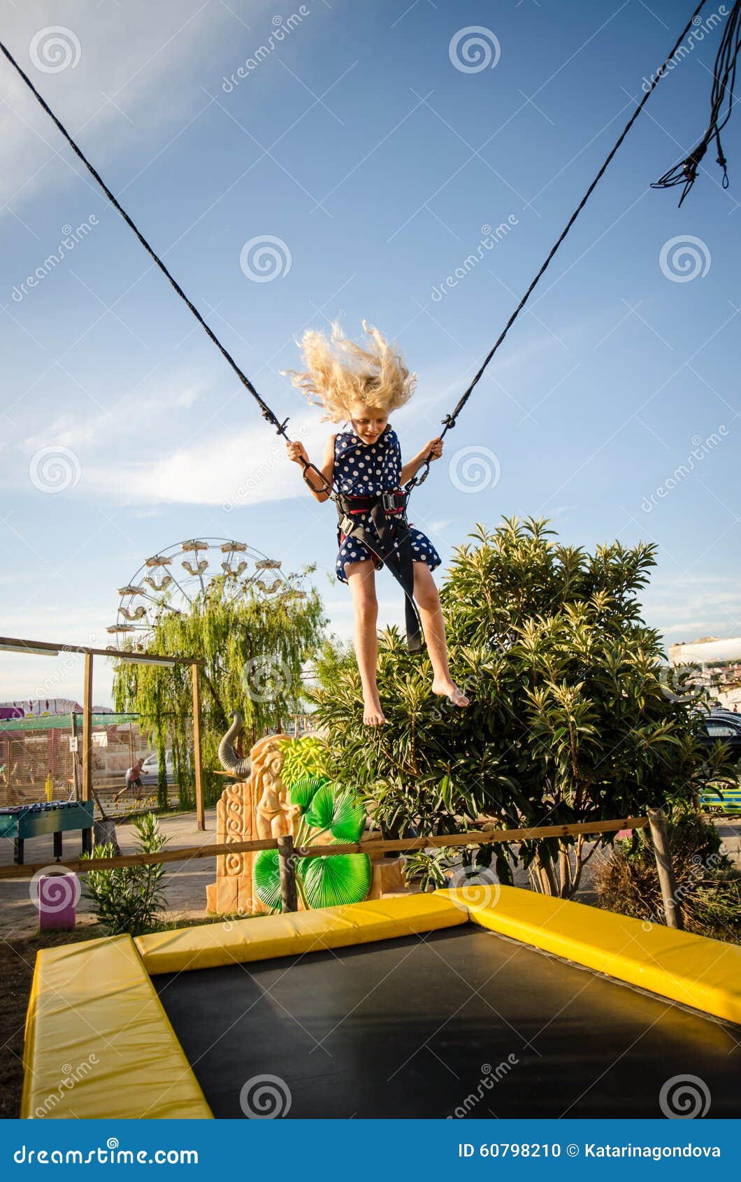 Child on bungee attraction stock photo. Image of long - 60798210