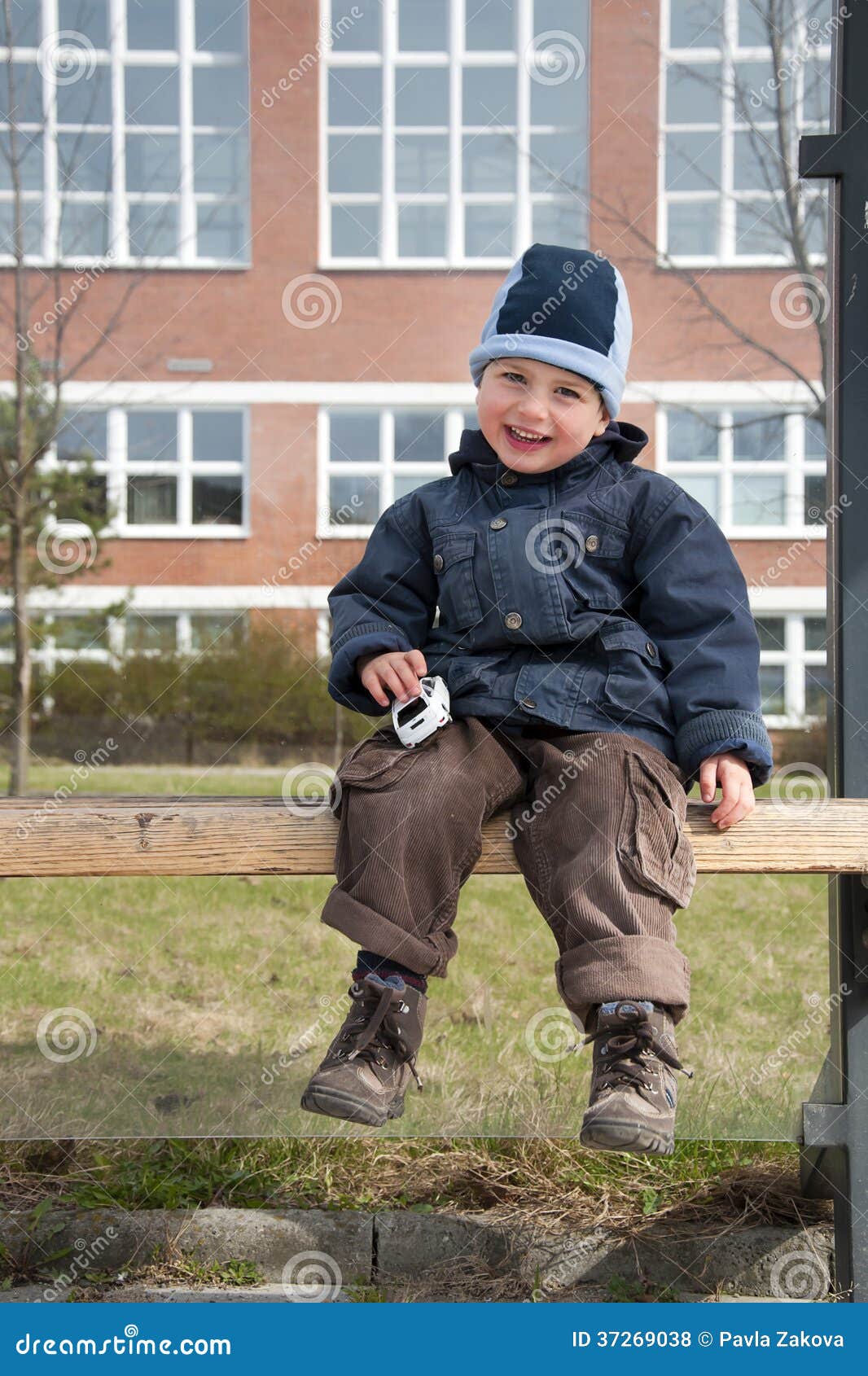 Child at bus stop stock photo. Image of young, town, little - 37269038