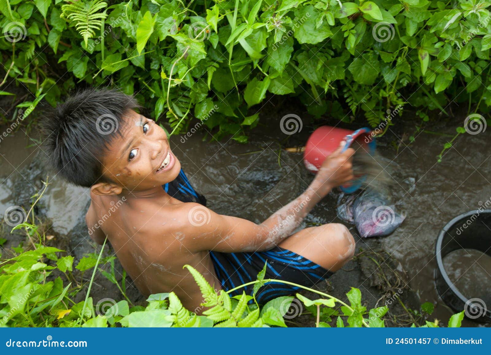Child Catches Small Fish in a Ditch Editorial Photography - Image of ...