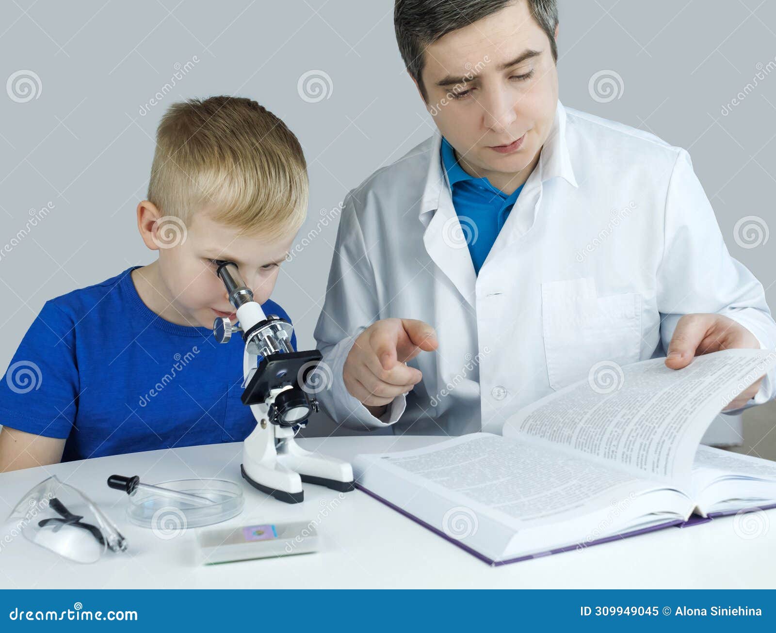 Child Chemist. Teacher Shows a Visual Experiment. a Science Mentor ...