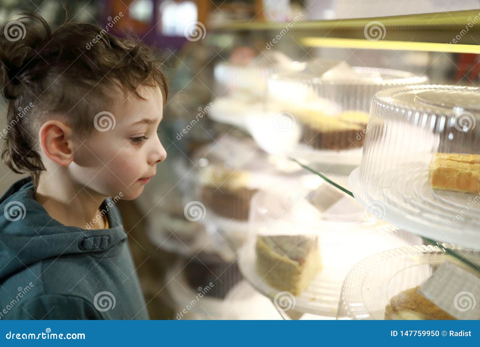 Child choosing cake stock photo. Image of looking, retail - 147759950