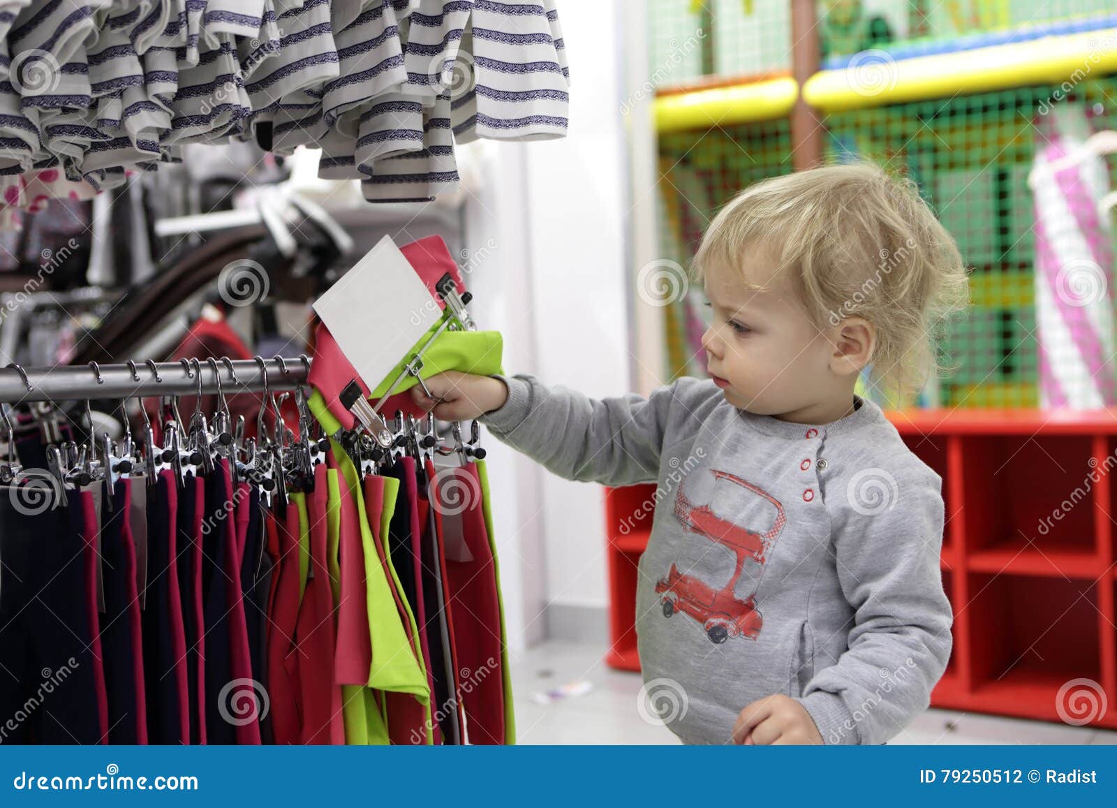 Child choosing clothes stock photo. Image of lifestyle - 79250512