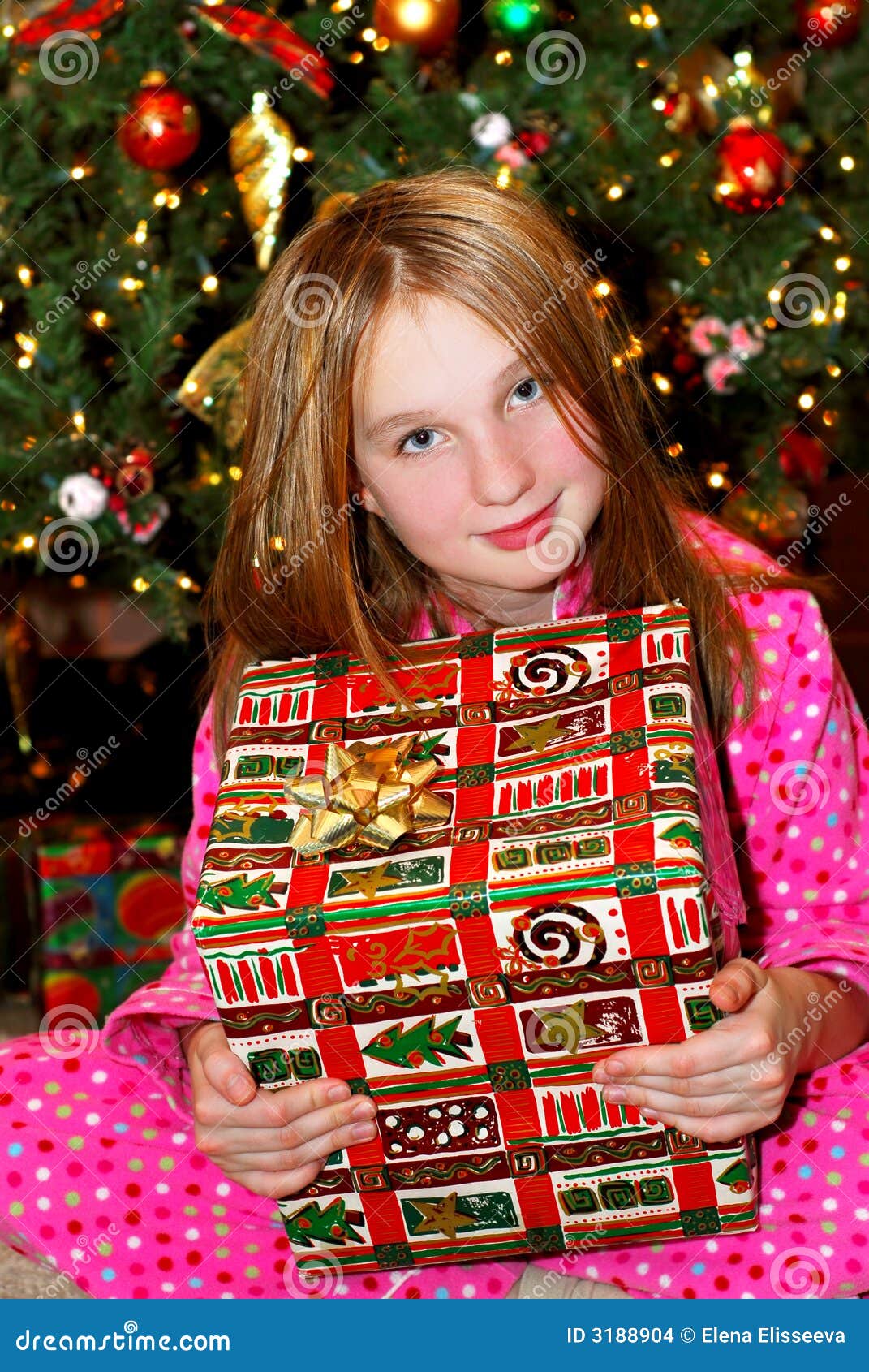 Child with Christmas Present Stock Photo - Image of holidays, pajamas ...