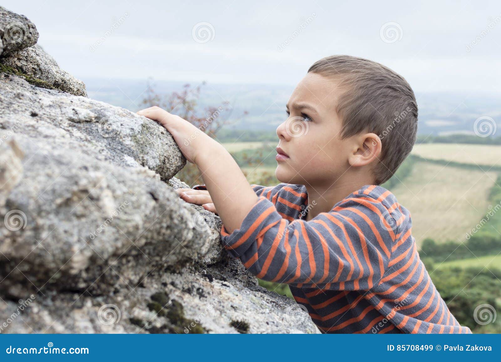Child climbing on rock stock image. Image of young, summer - 85708499