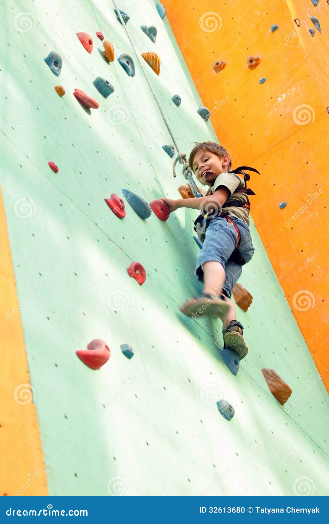 Child climbing up the wall stock photo. Image of people - 32613680