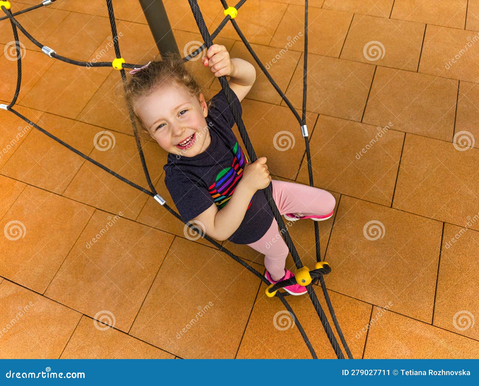 A Child Climbs on an Attraction with Ropes. Stock Image - Image of ...