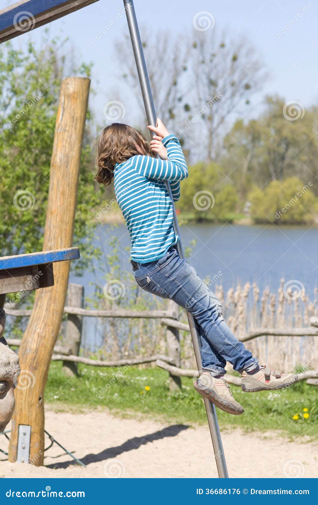 Child climbs on a pole stock photo. Image of slip, jungle - 36686176