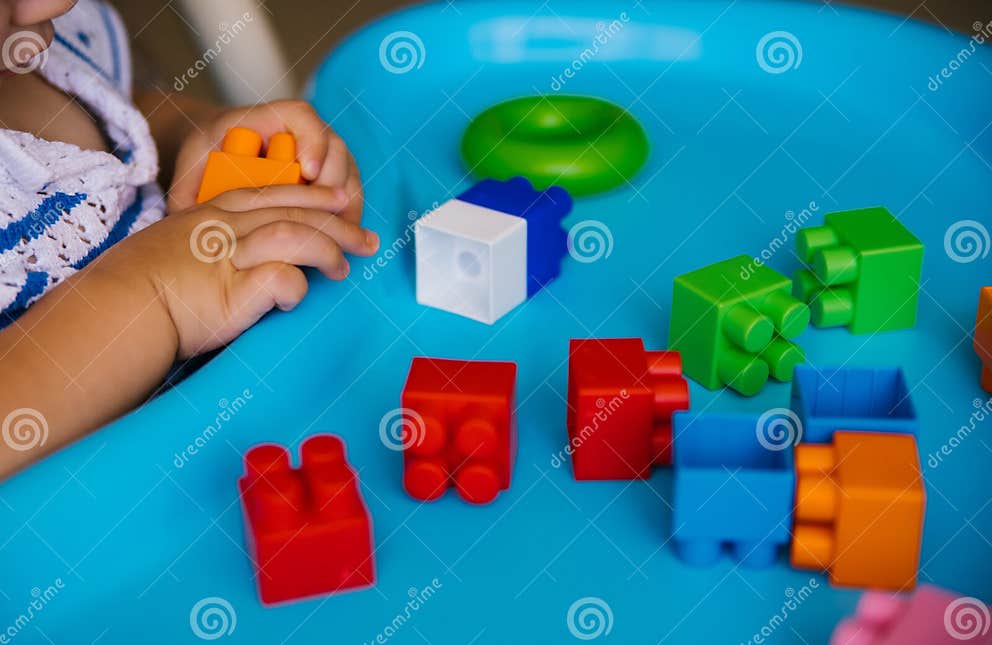 The Child Collects a Multi-colored Constructor. Children`s Classes in ...