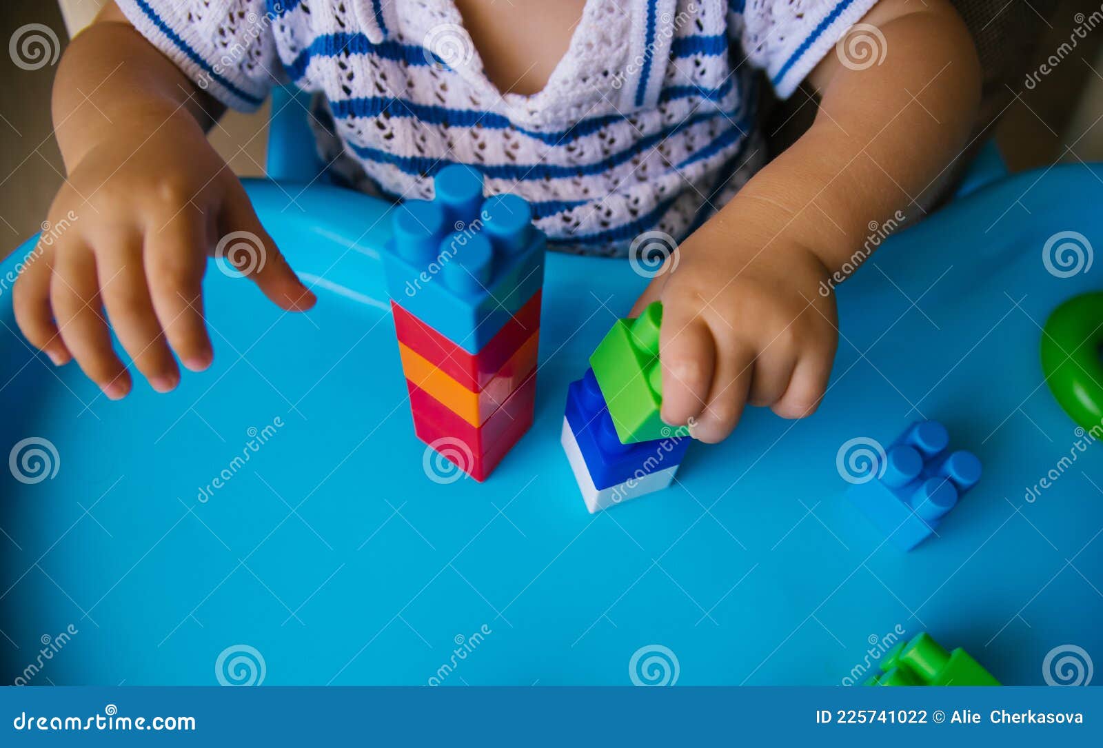 The Child Collects a Multi-colored Constructor. Children`s Classes in ...