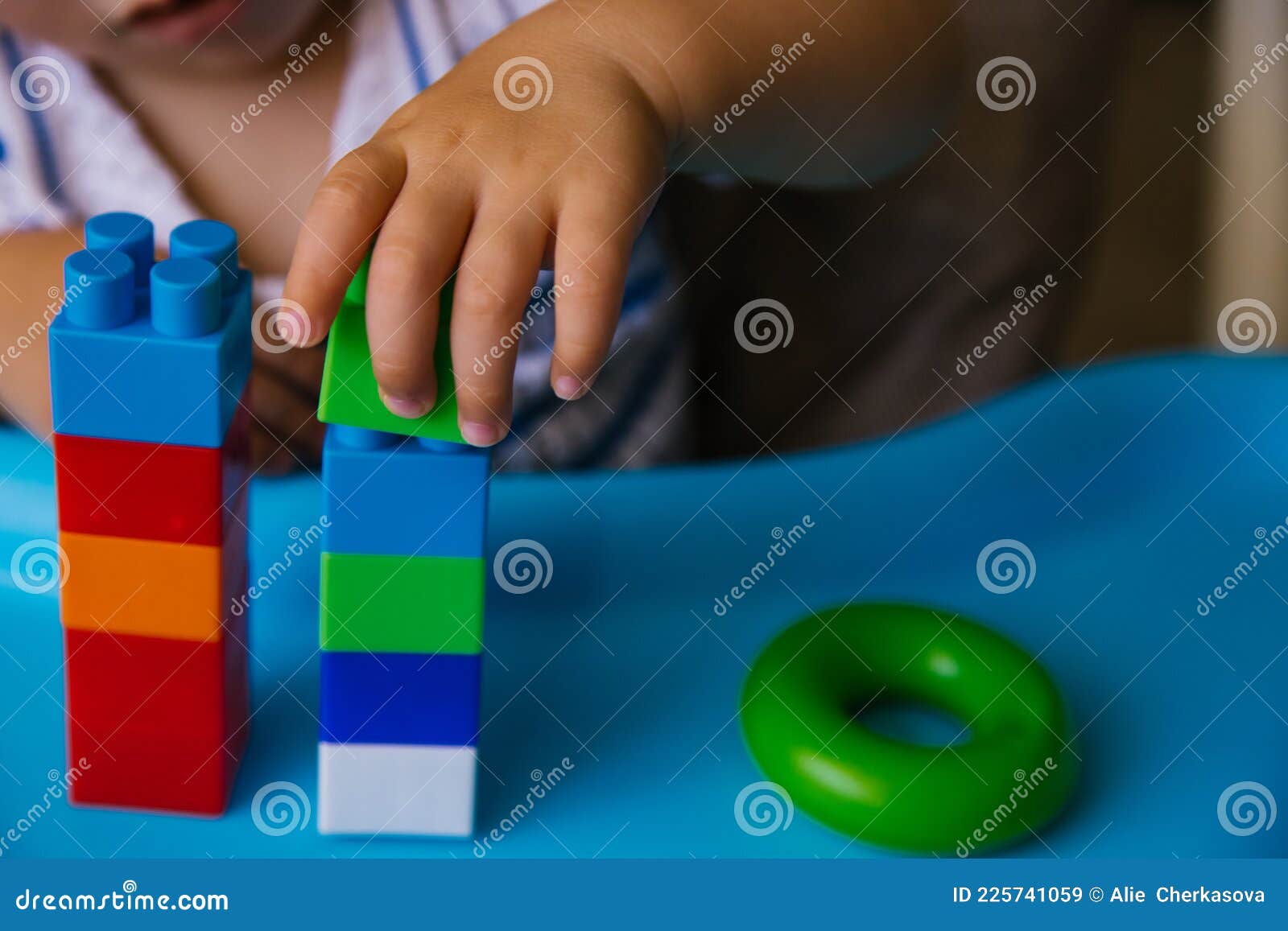 The Child Collects a Multi-colored Constructor. Children`s Classes in ...